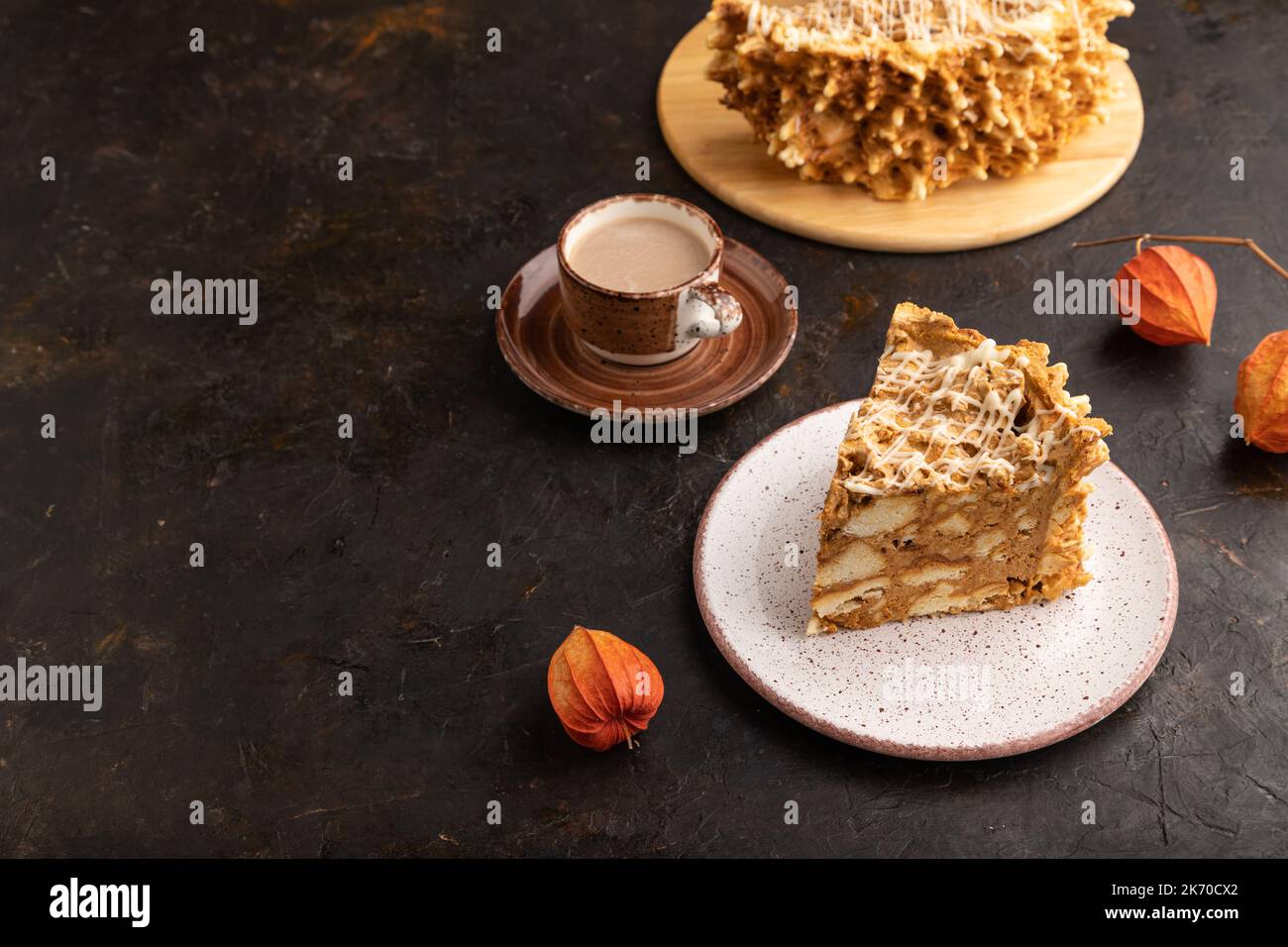 Traditional lithuanian cake shakotis with cup of coffee on black ...