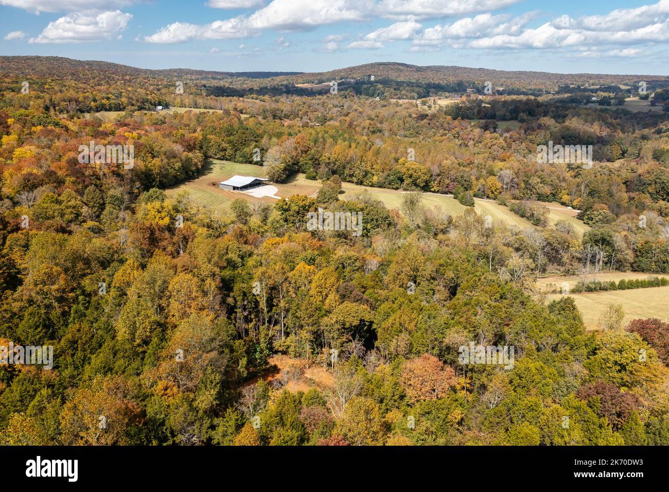 Aerial view, of colorful autumn mountain landscape, with a valley barn ...