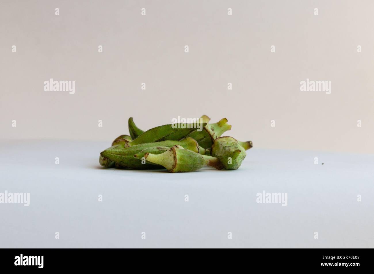 Okras are isolated on a white background Stock Photo - Alamy