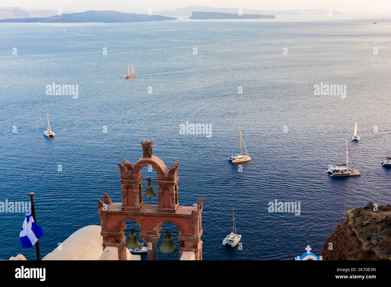 A view of of boats on ocean from Fira, Santorini in the Greek Isles ...
