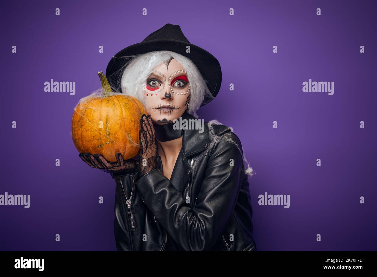 Scared surprised witch with grey hair on Halloween Stock Photo - Alamy