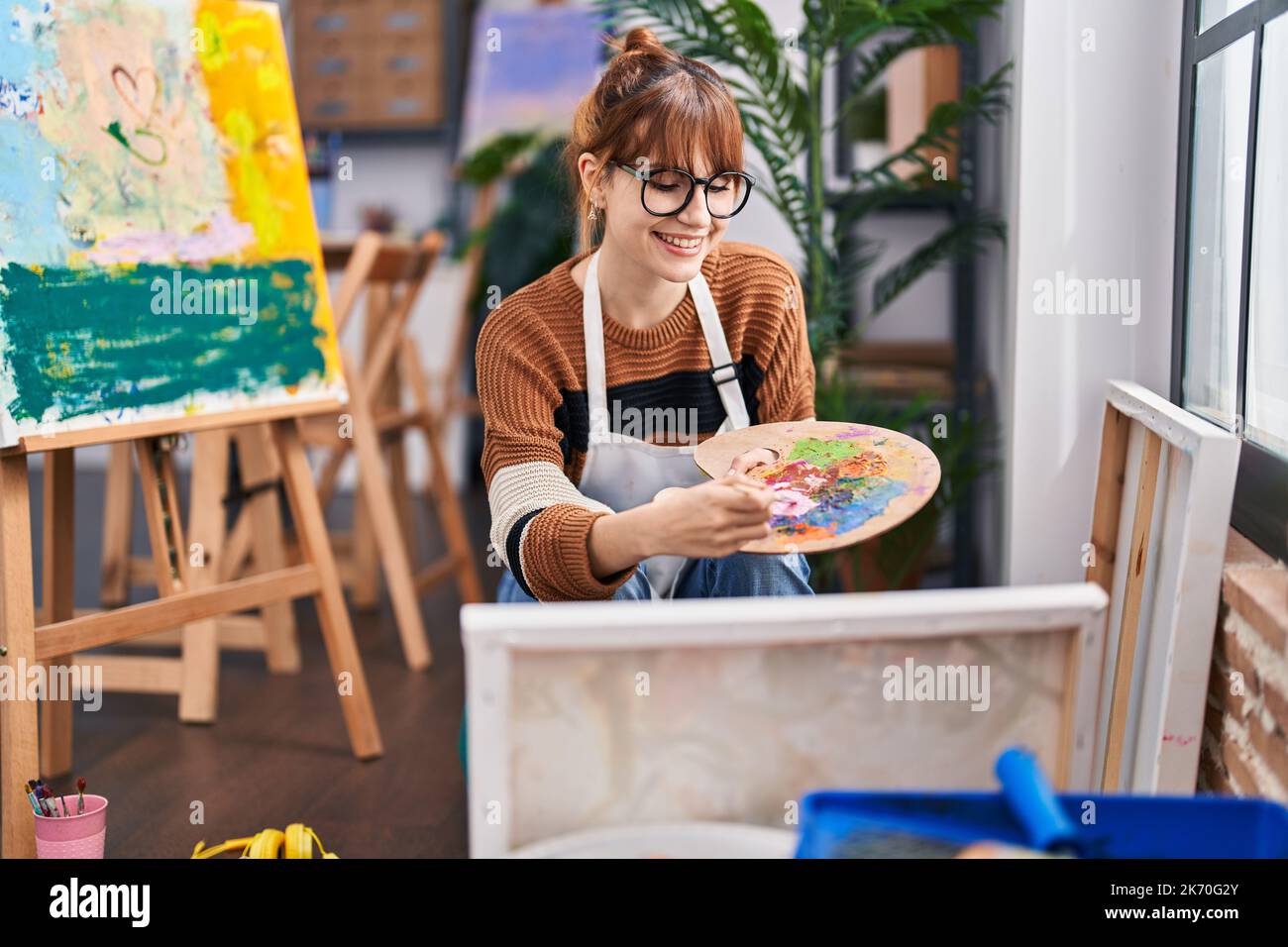 Young woman artist smiling confident drawing at art studio Stock Photo ...