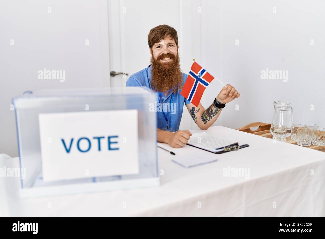 Caucasian man with long beard at political campaign election holding ...