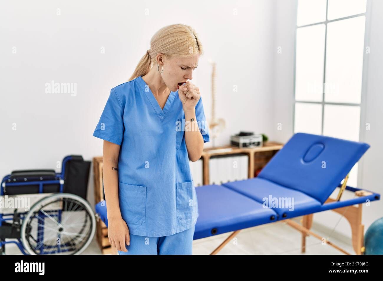 Beautiful caucasian physiotherapist woman working at pain recovery ...
