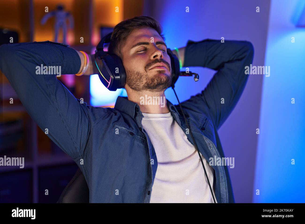 Young caucasian man streamer smiling confident relaxed with hands on ...