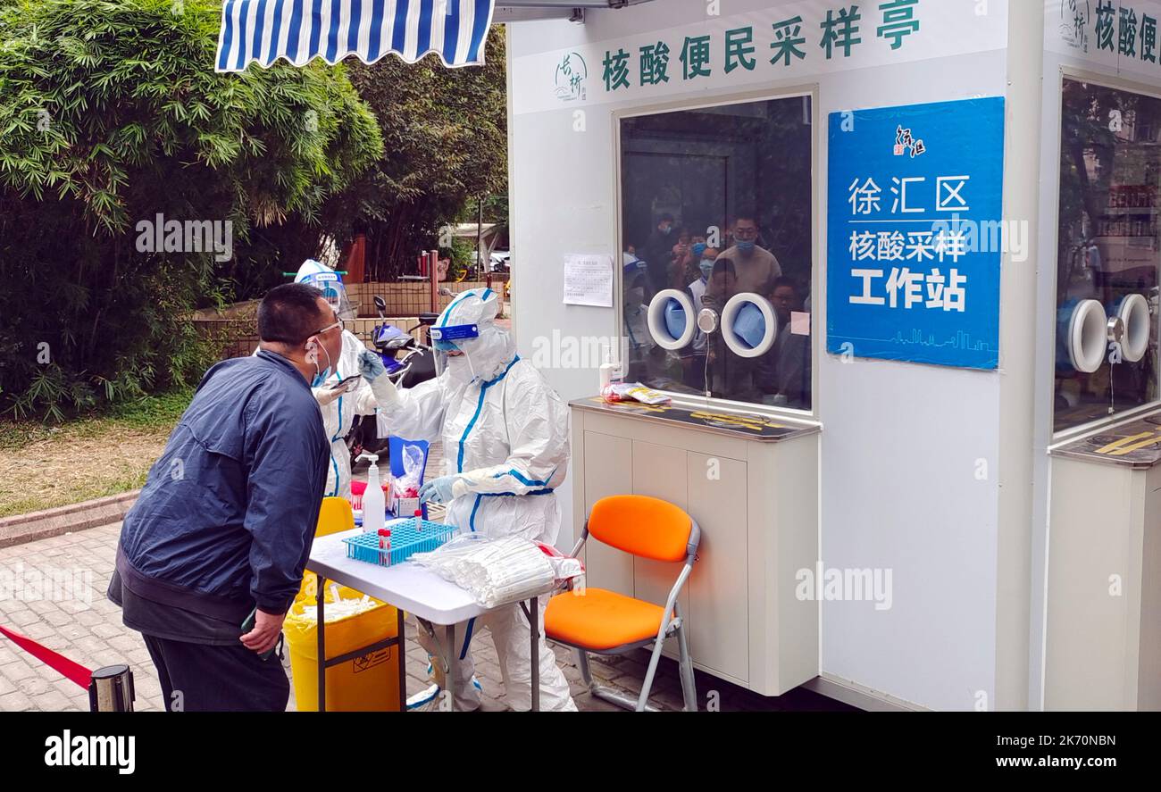 SHANGHAI, CHINA - OCTOBER 16, 2022 - Residents are tested at a ...