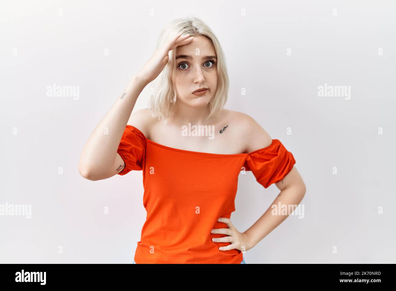 Young caucasian woman standing over isolated background worried and ...