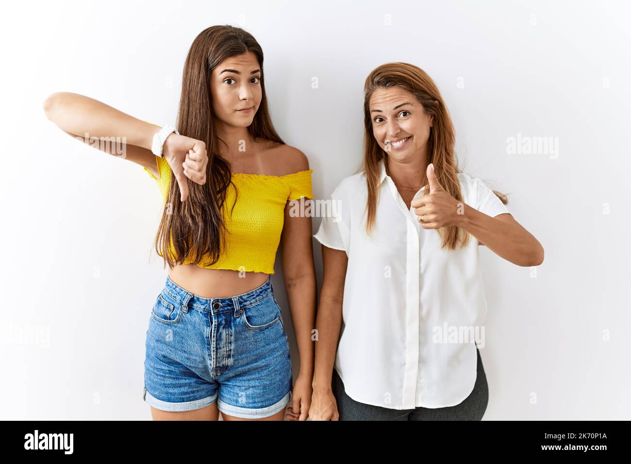 Mother And Daughter Together Standing Together Over Isolated Background