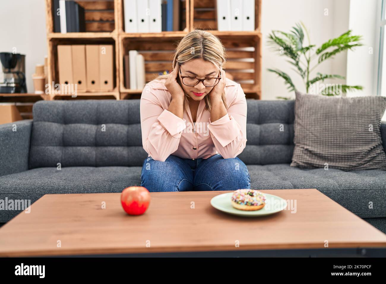 Young hispanic woman patient with eating disorder having psychology ...