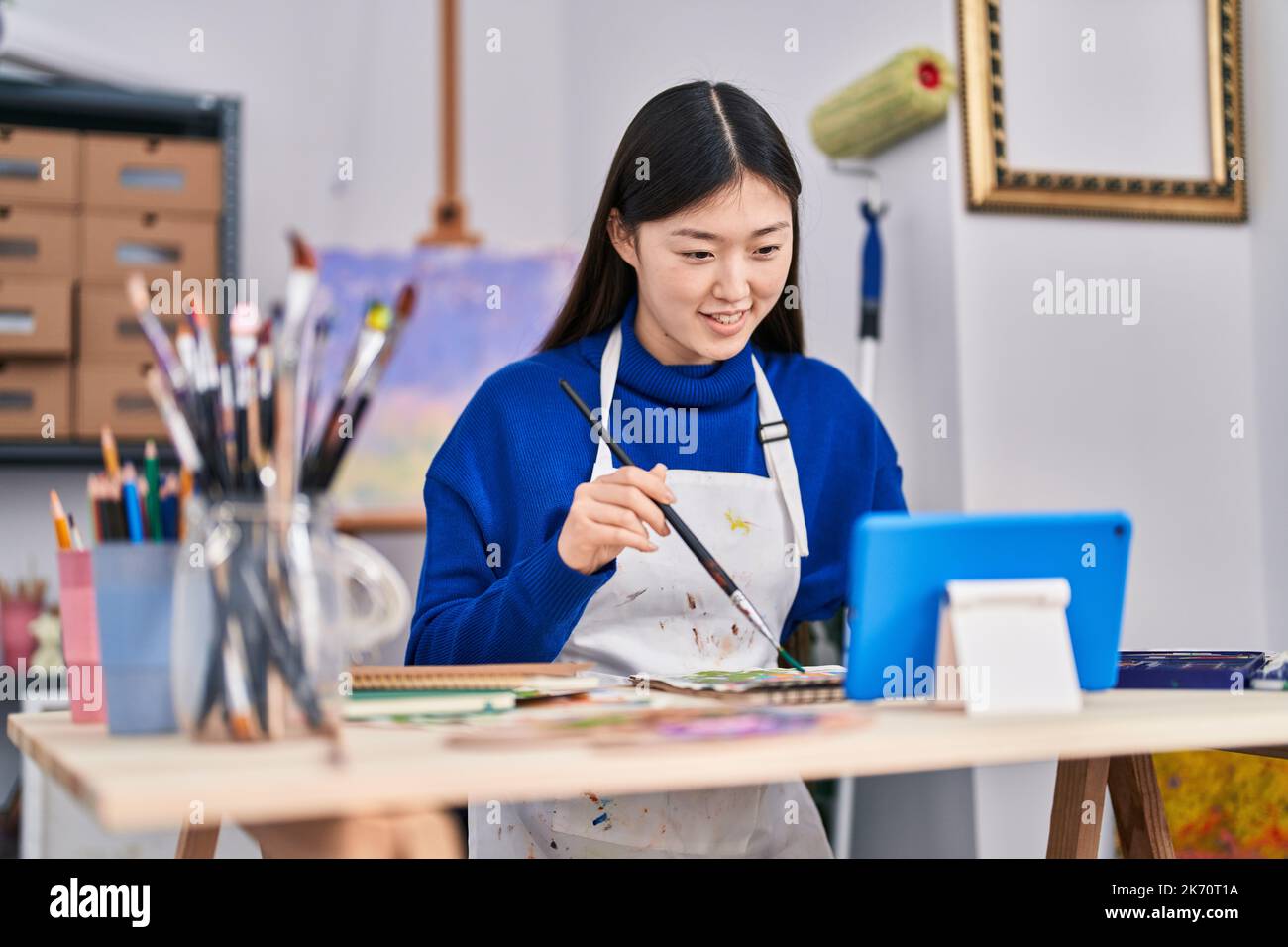Chinese woman artist having online drawing class at art studio Stock ...