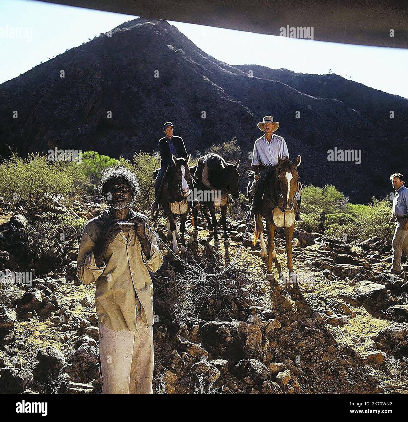 DAVID GULPILIL, GARY SWEET, DAMON GAMEAU, THE TRACKER, 2002 Stock Photo ...