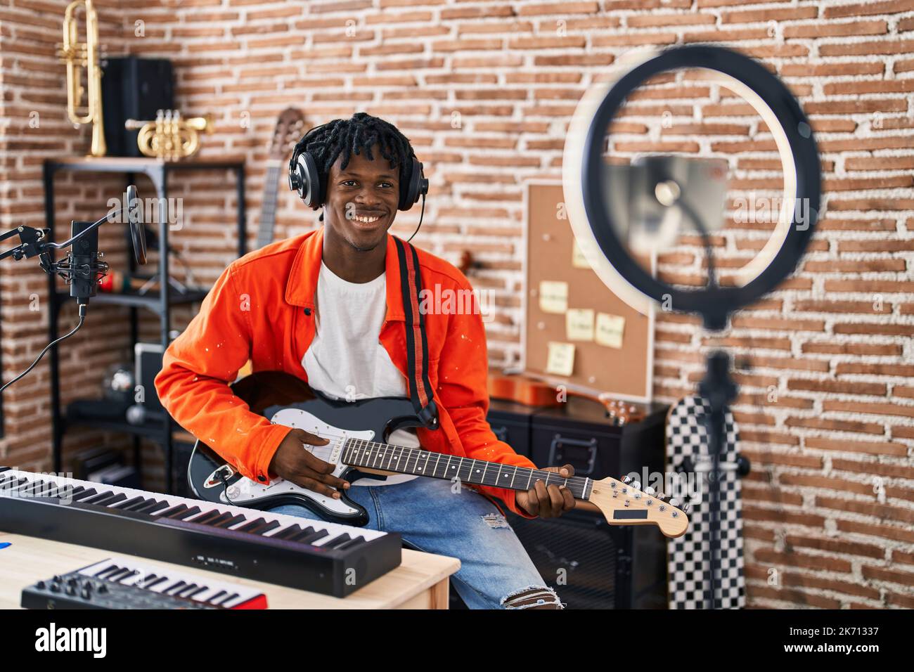 African american man artist having electrical guitar online lesson at ...