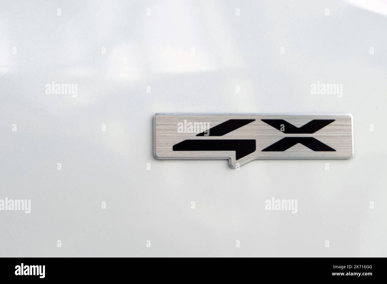 Close up of all wheel drive symbol in a car surface Stock Photo - Alamy