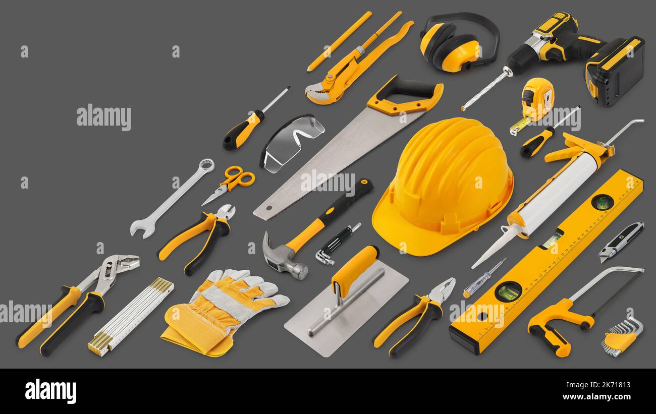 Construction work tools for building. Yellow hard hat with work ...