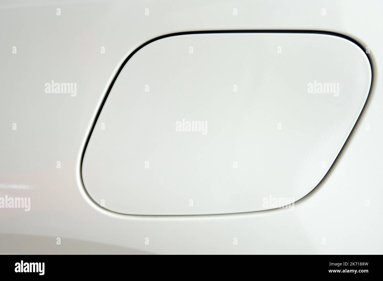 Close up of a gas tank cover on a modern white car Stock Photo - Alamy