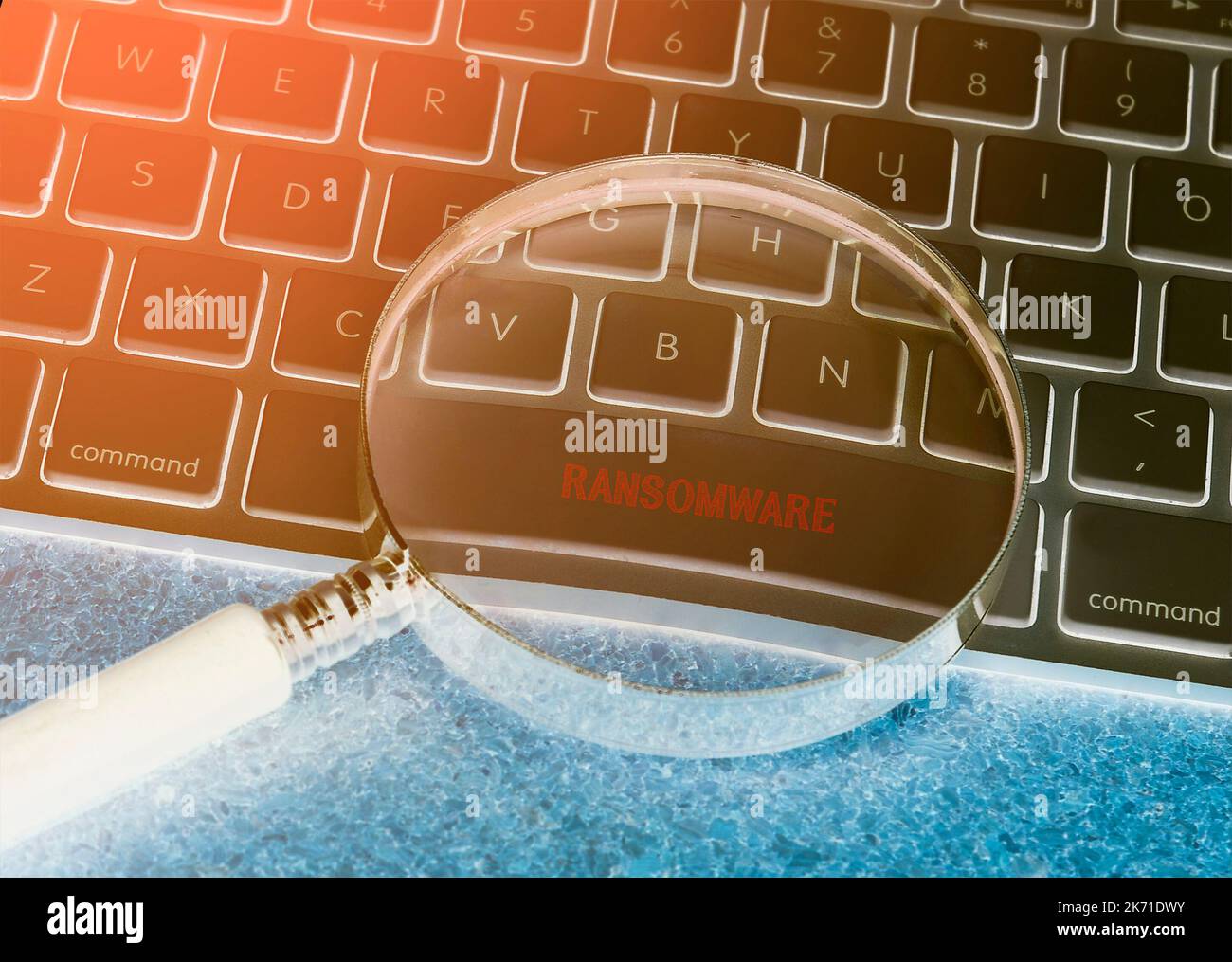 Business concept: RANSOMWARE on computer keyboard on wooden background ...