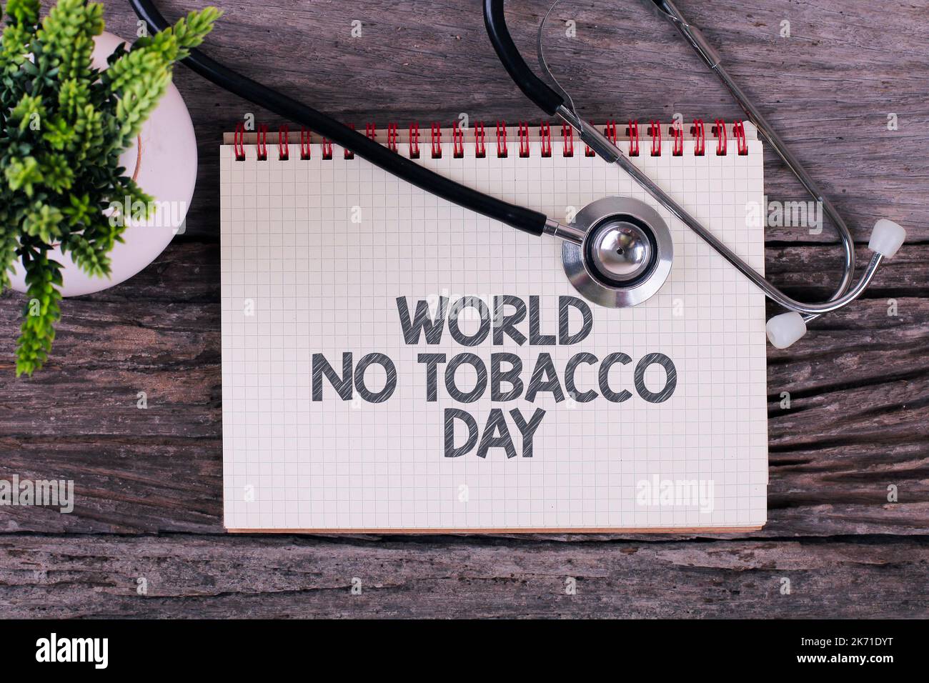 WORLD NO TOBACCO DAY word on notebook,stethoscope and green plant Stock ...