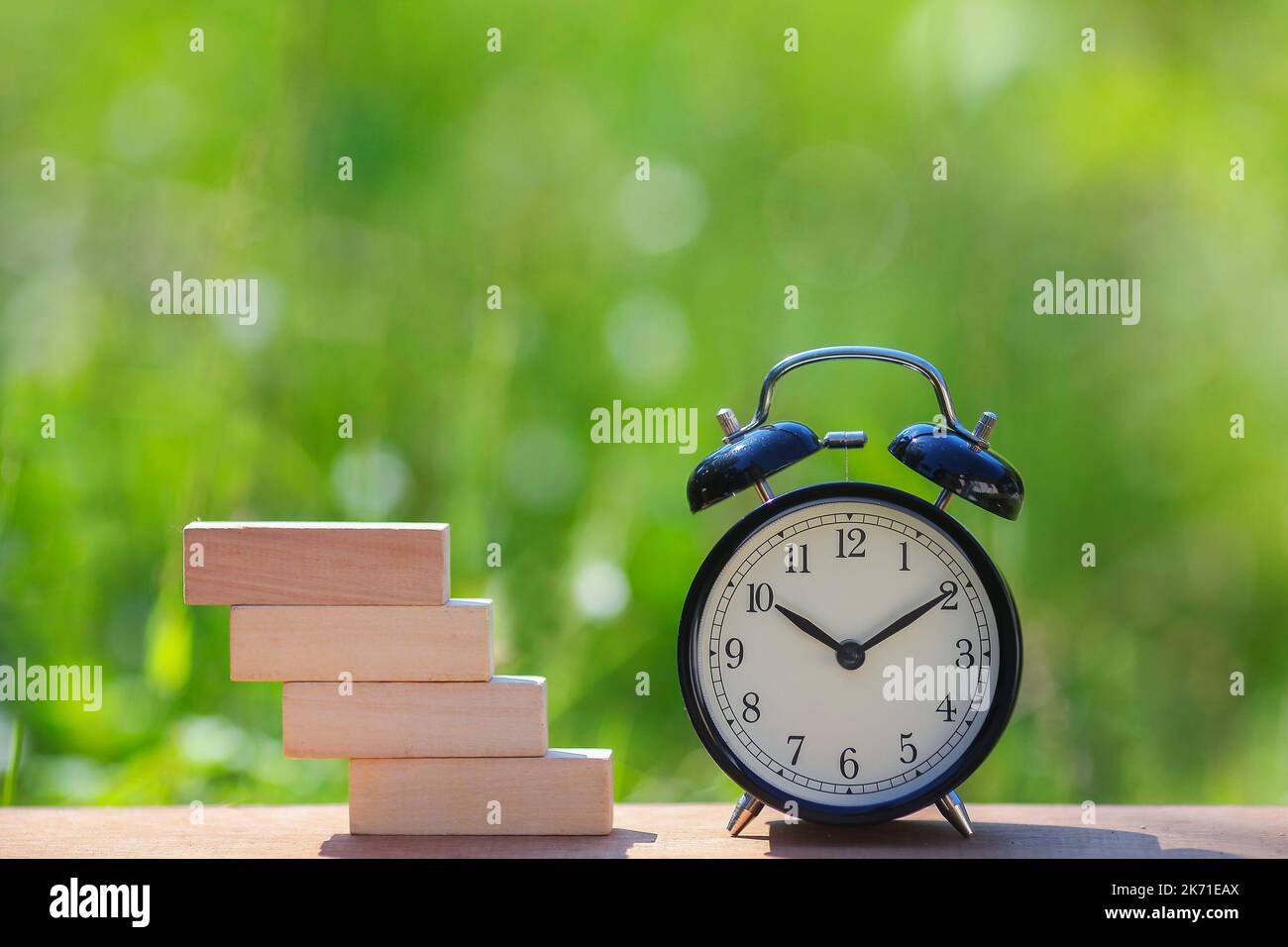 Alarm clock wooden blocks table hi-res stock photography and images - Alamy