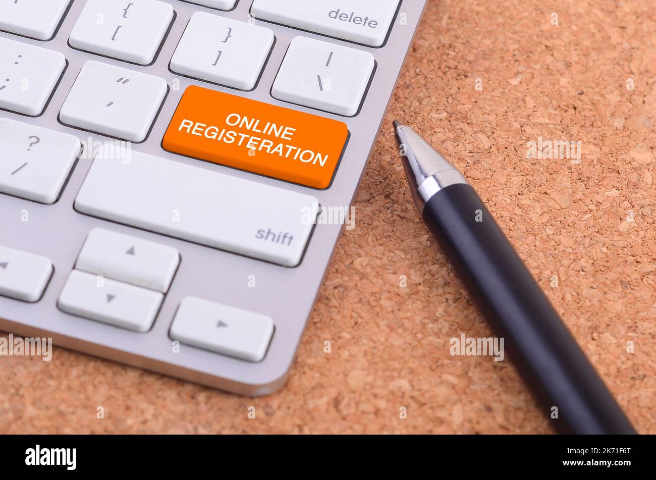 Business concept: computer keyboard with ONLINE REGISTERATION word on enter button background ...