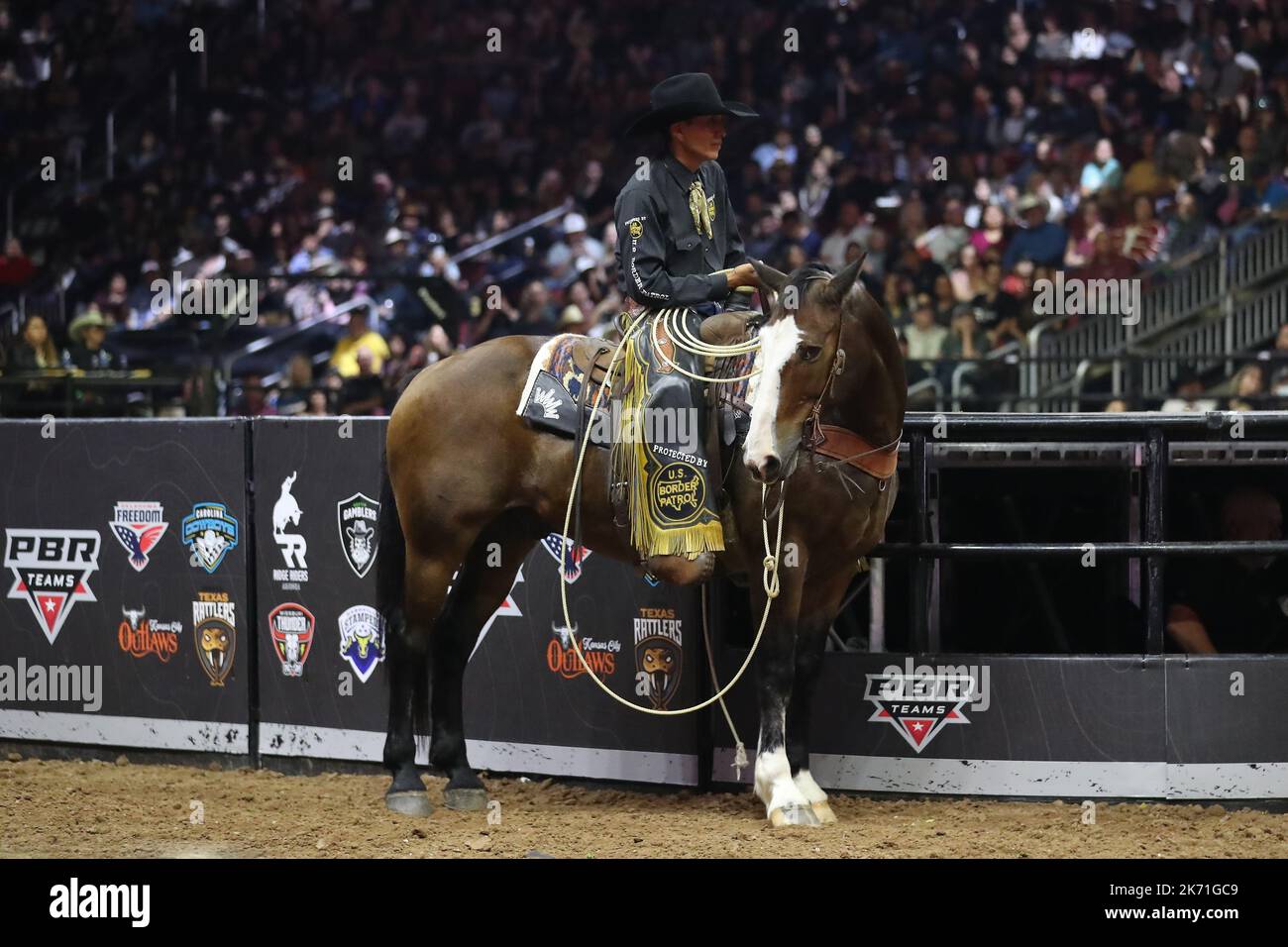 GLENDALE, AZ - OCTOBER 15: A member of the PBR Safety Team stands ready ...