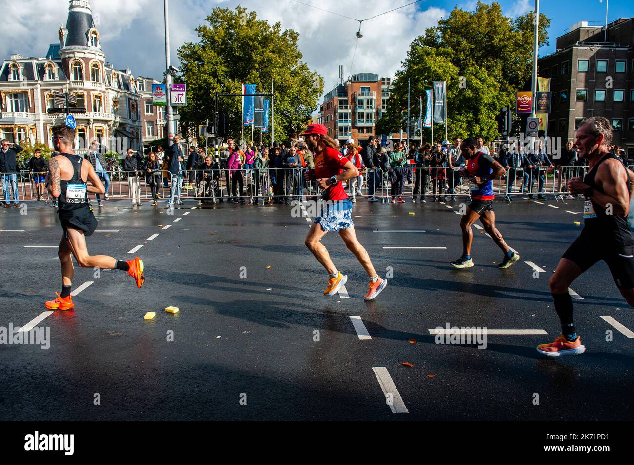 Participants are seen running the last kilometers before the finish ...