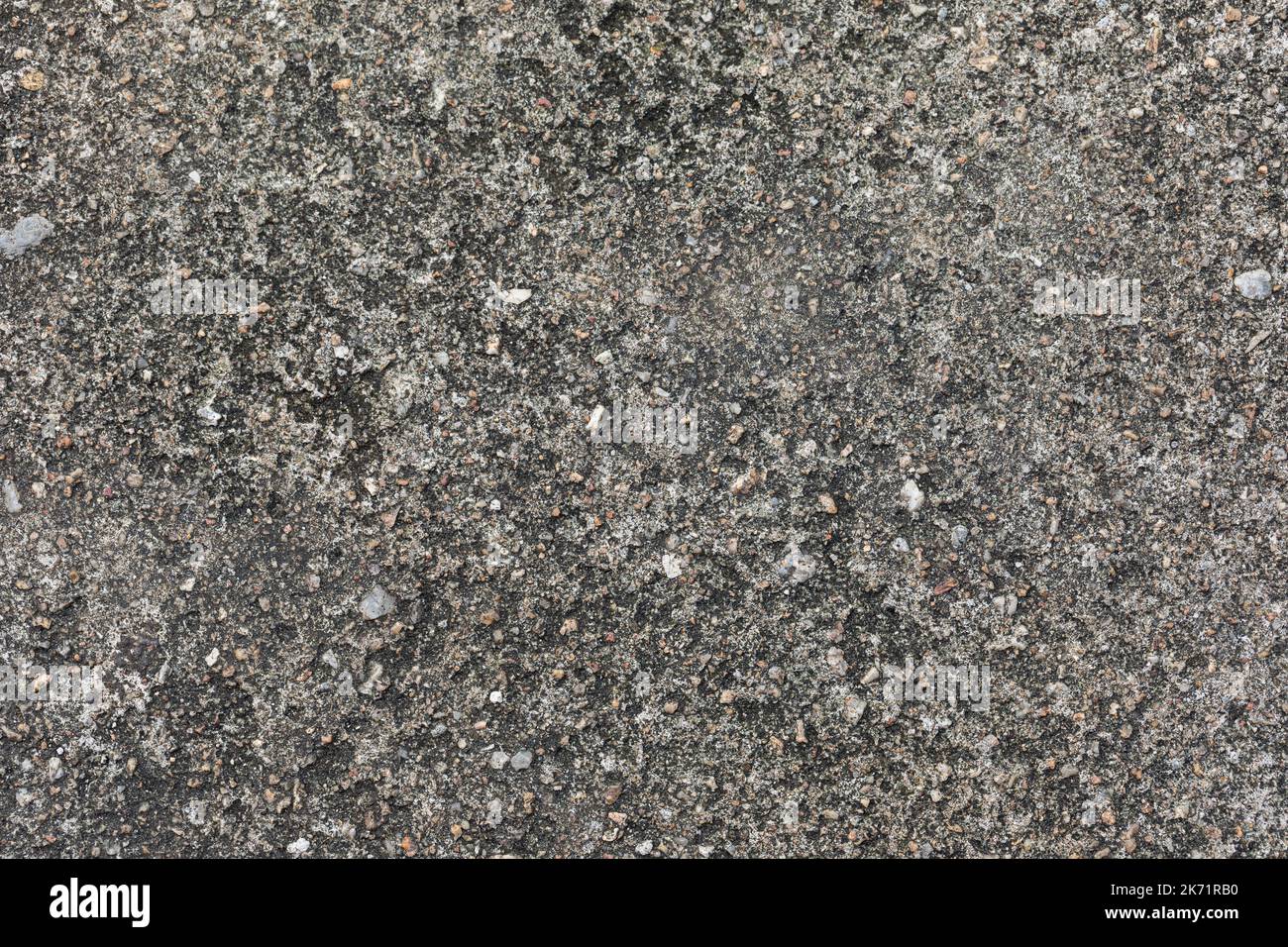 Gray textured cement wall background with fine concrete chips ...
