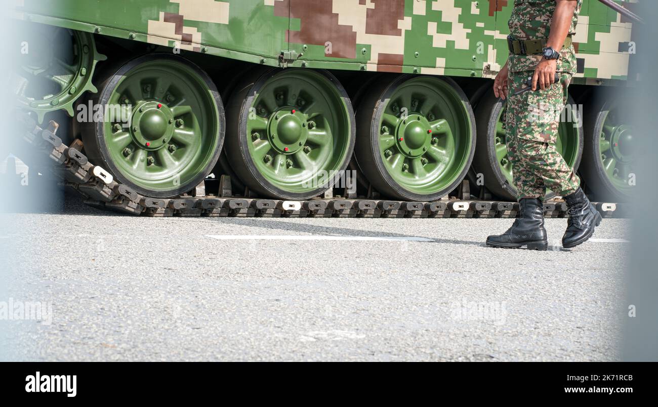 Soldier standing next to military tank hi-res stock photography and ...