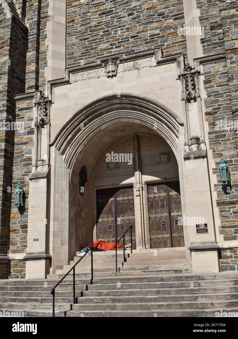 A homeless man sleeping in the doorway of The First Congregational ...