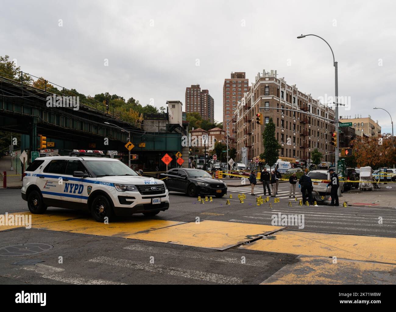 Members of the Crime Scene Unit investigate a police shooting with ...