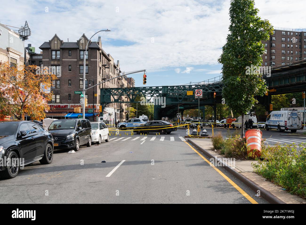 Members of the Crime Scene Unit investigate a police shooting with ...