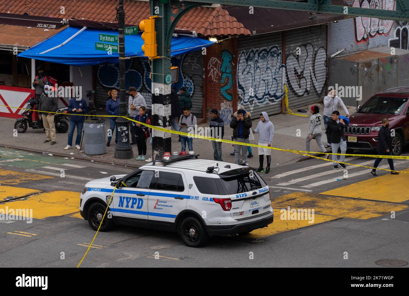 Members of the Crime Scene Unit investigate a police shooting with ...