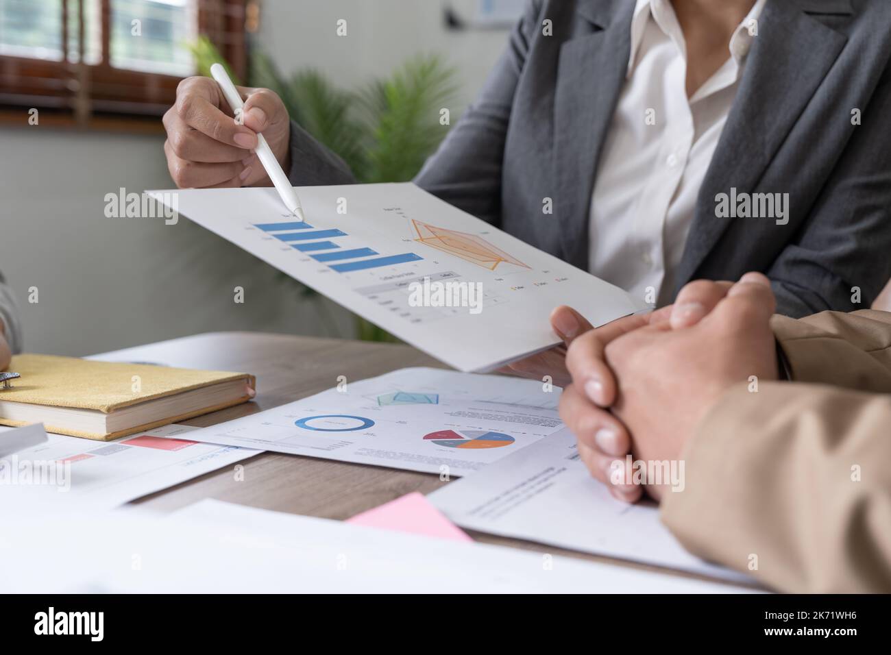 Business team analyzing income charts and graphs with modern laptop ...