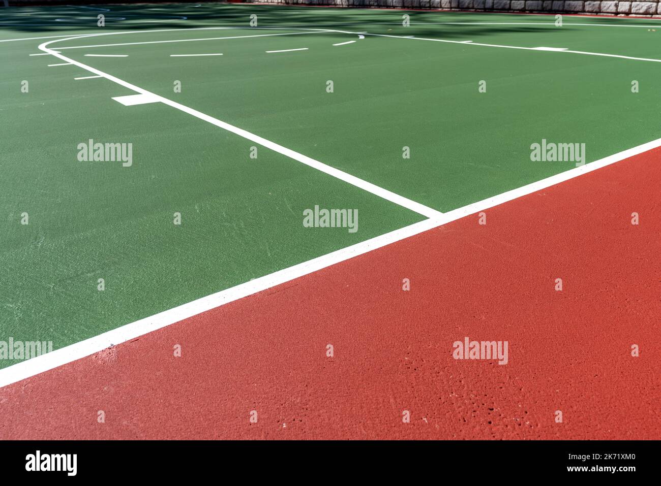 Interesting green and red outdoor basketball court at school playground ...