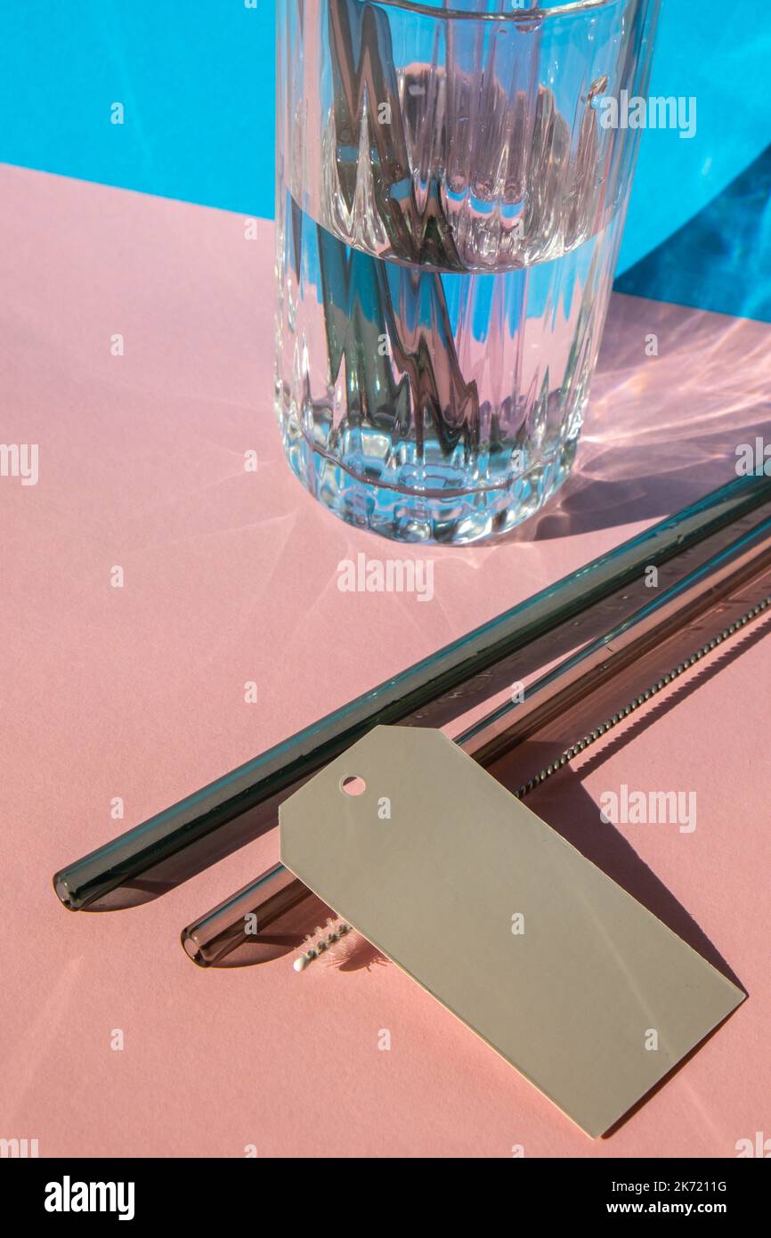 Reusable glass Straws in Glass with water on colorful background with ...