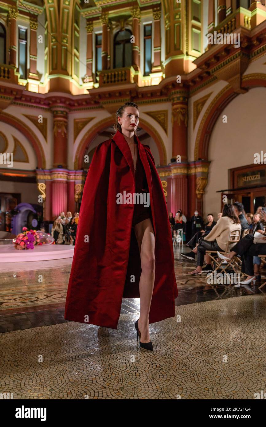 A model wearing an outfit by designer Martin Grant walks the runway ...