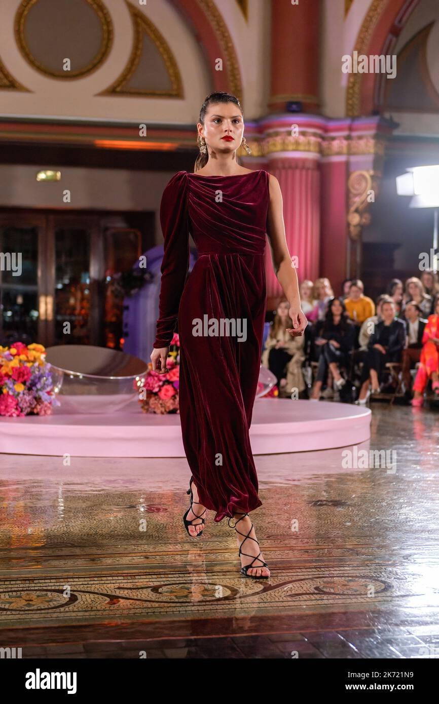 A model wearing an outfit by designer Leo Lin walks the runway during ...