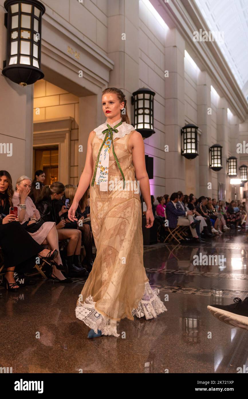 A model wearing an outfit by designer Nevenka walks the runway during ...