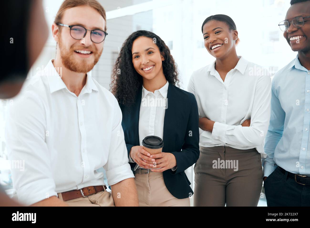 Getting to know each other. a group of businesspeople standing in an ...