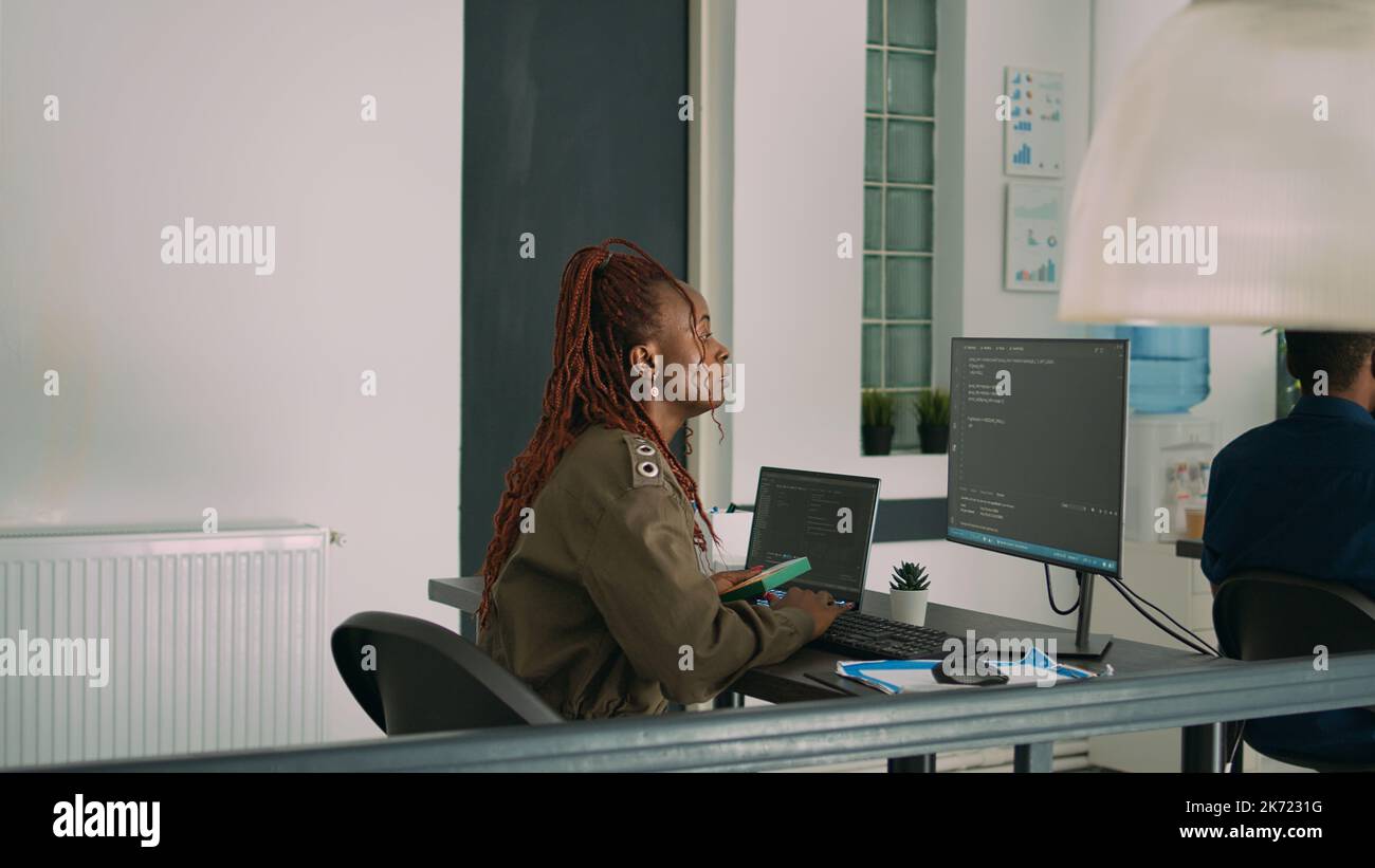 African American Coder Using Computer To Write Code And Develop Algorithm Program In Software