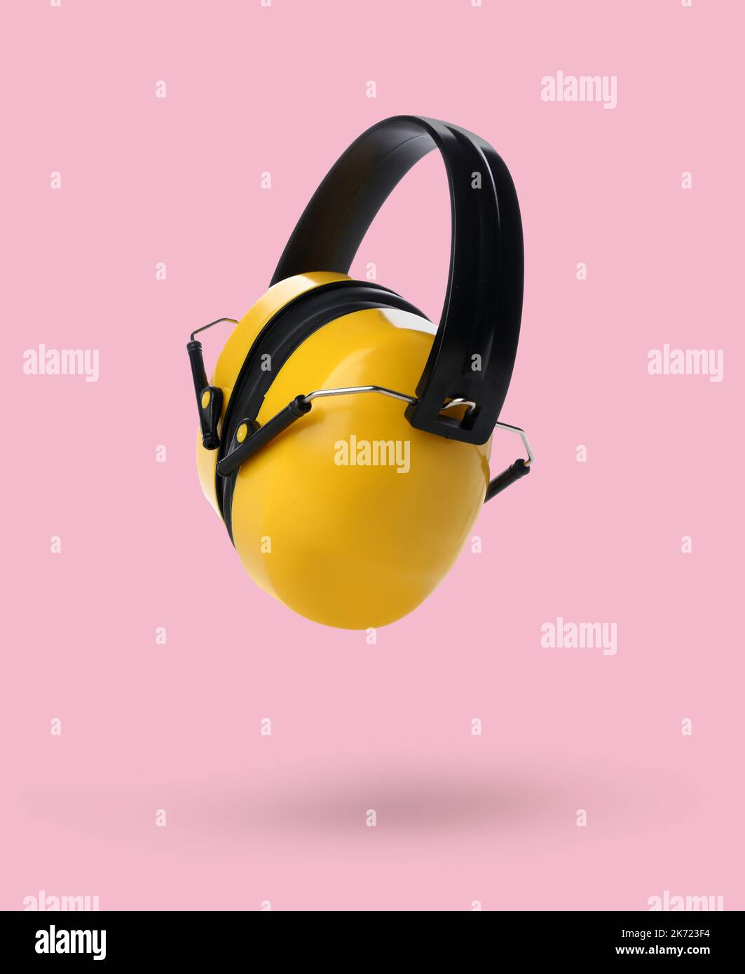 Modern hearing protectors on pink background Stock Photo - Alamy