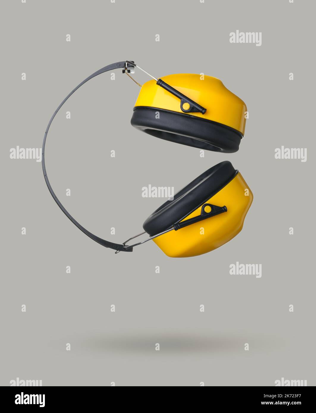 Modern hearing protectors on grey background Stock Photo - Alamy