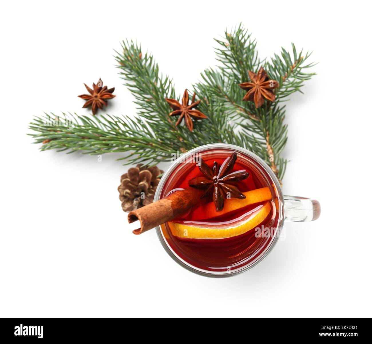 Cup of aromatic mulled wine and fir branch on white background Stock ...