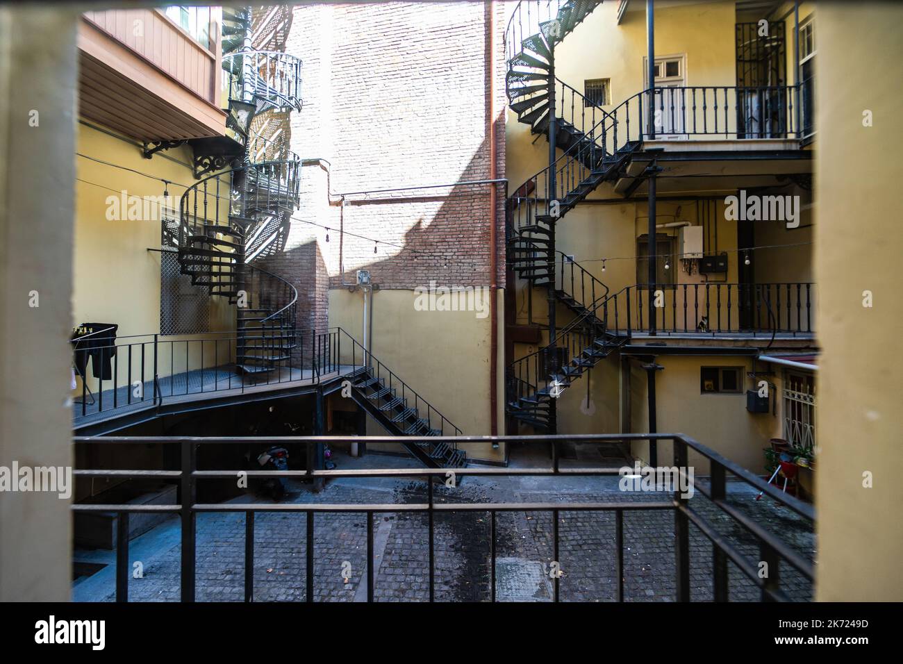 Spiral stairs in inner yard in Tbilisi Old town, capital city of ...