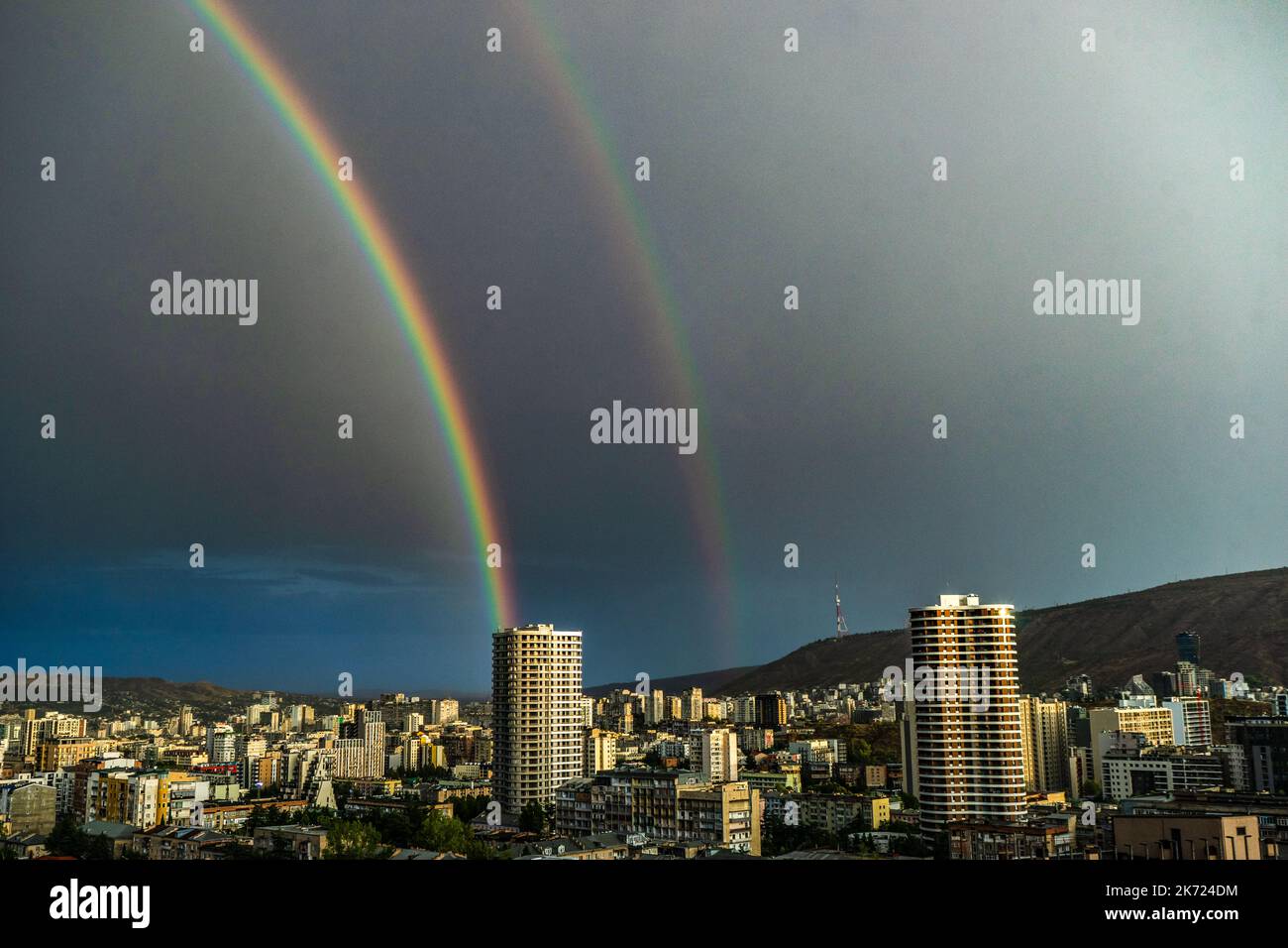 Double rainbow over Tbilisi's downtown after the rain, capital city of ...