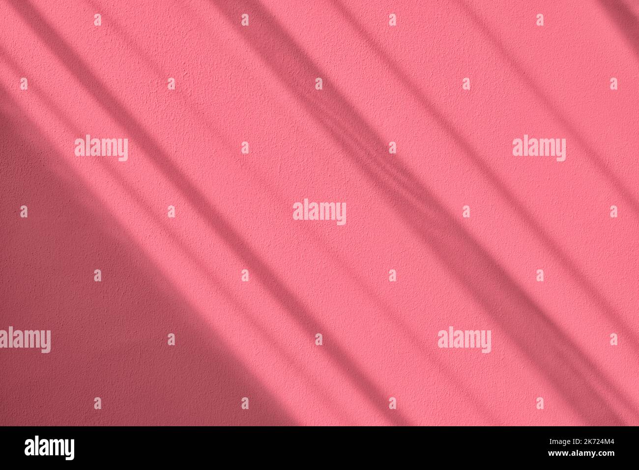 Shadow and light on solid pink wall texture background Stock Photo - Alamy
