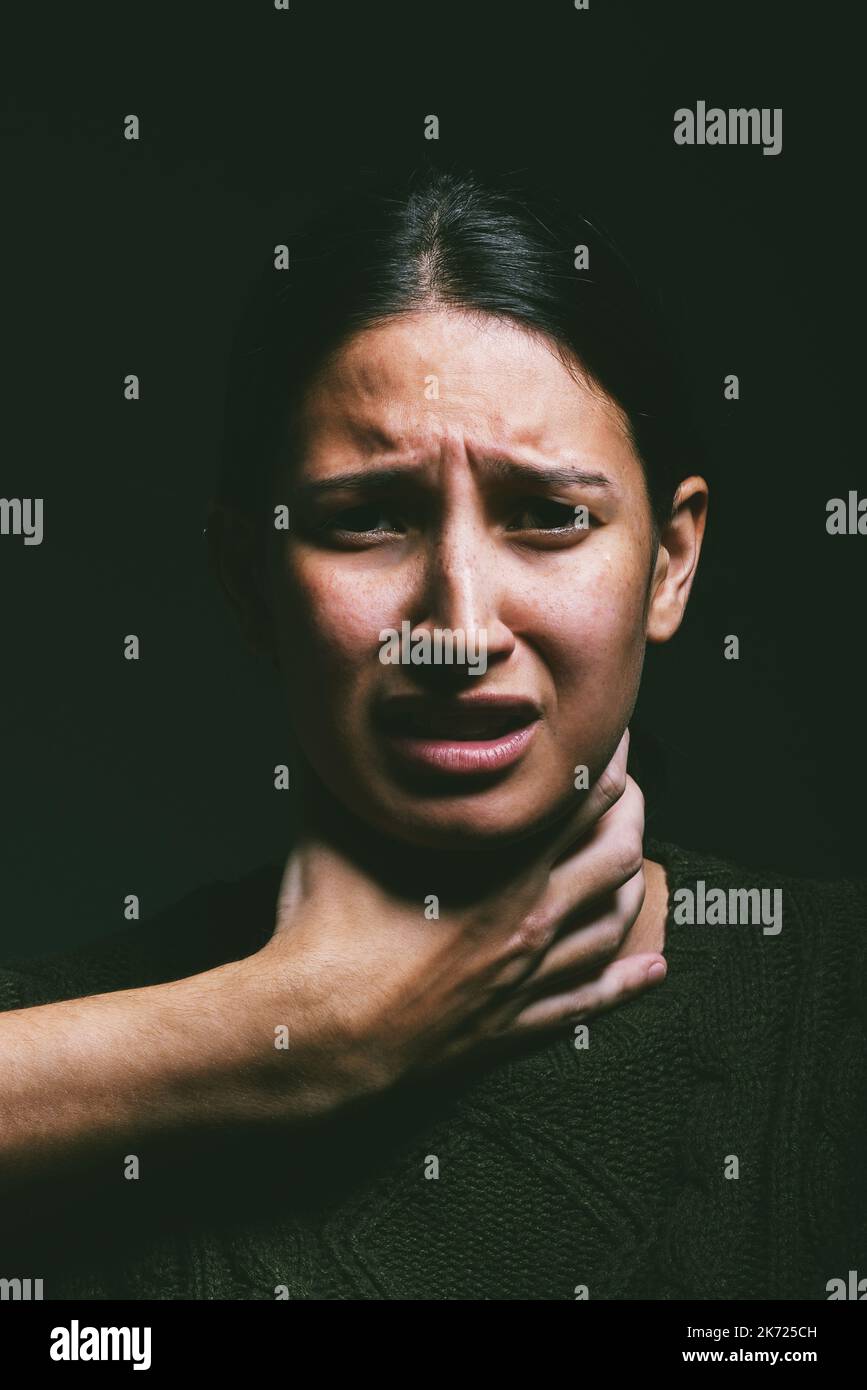 I Cant Breathe A Young Woman Being Strangle By An Unrecognisable Man Against A Black Background