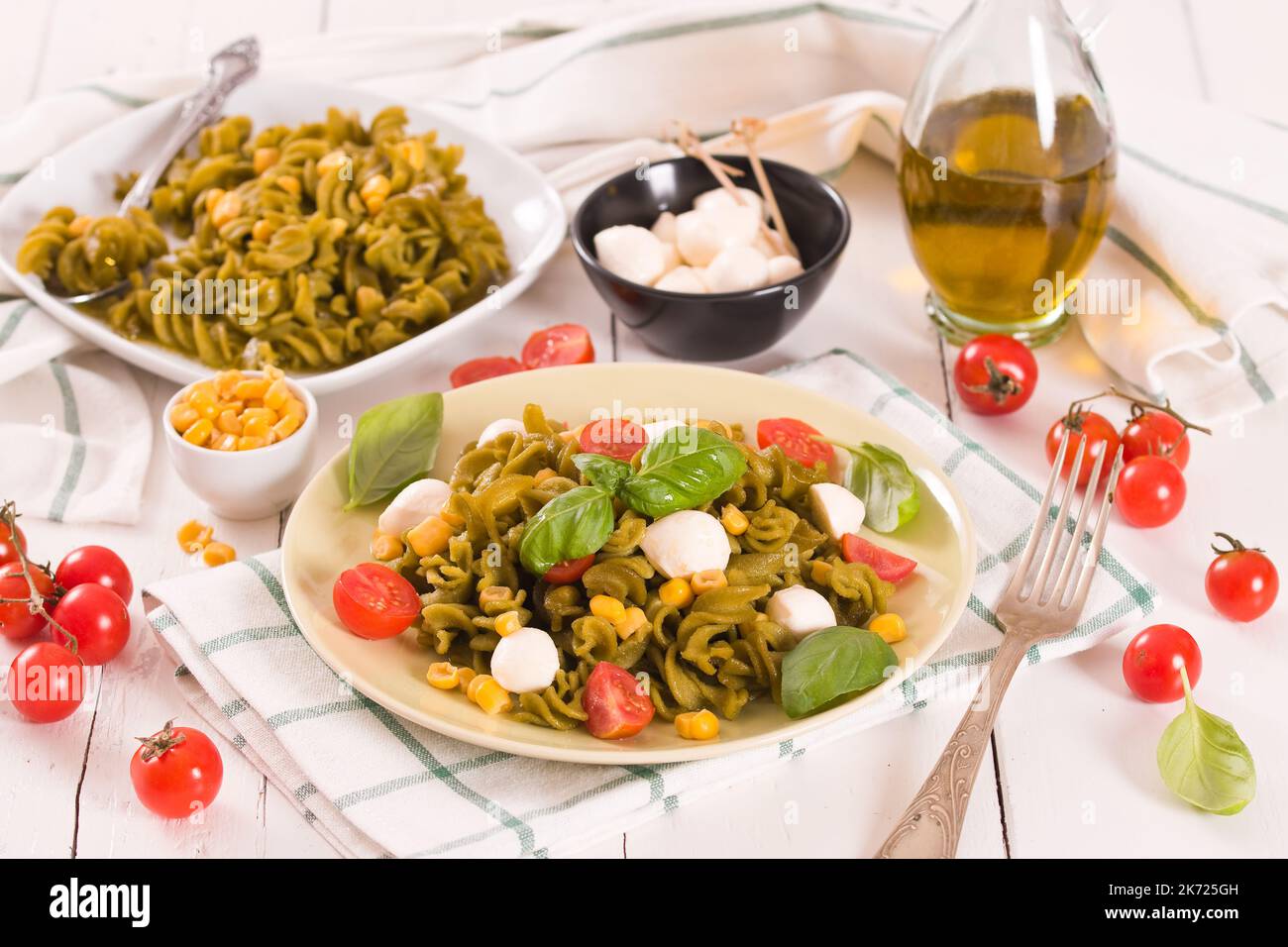 Fusilli pasta with cherry tomatoes and sweet corn Stock Photo - Alamy