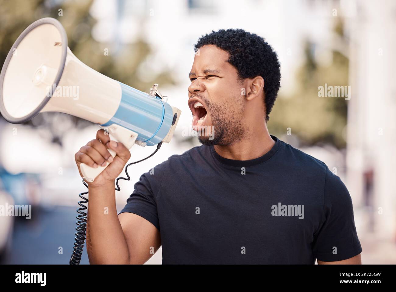Megaphone, protest and angry black man talking at riot in Nigeria ...