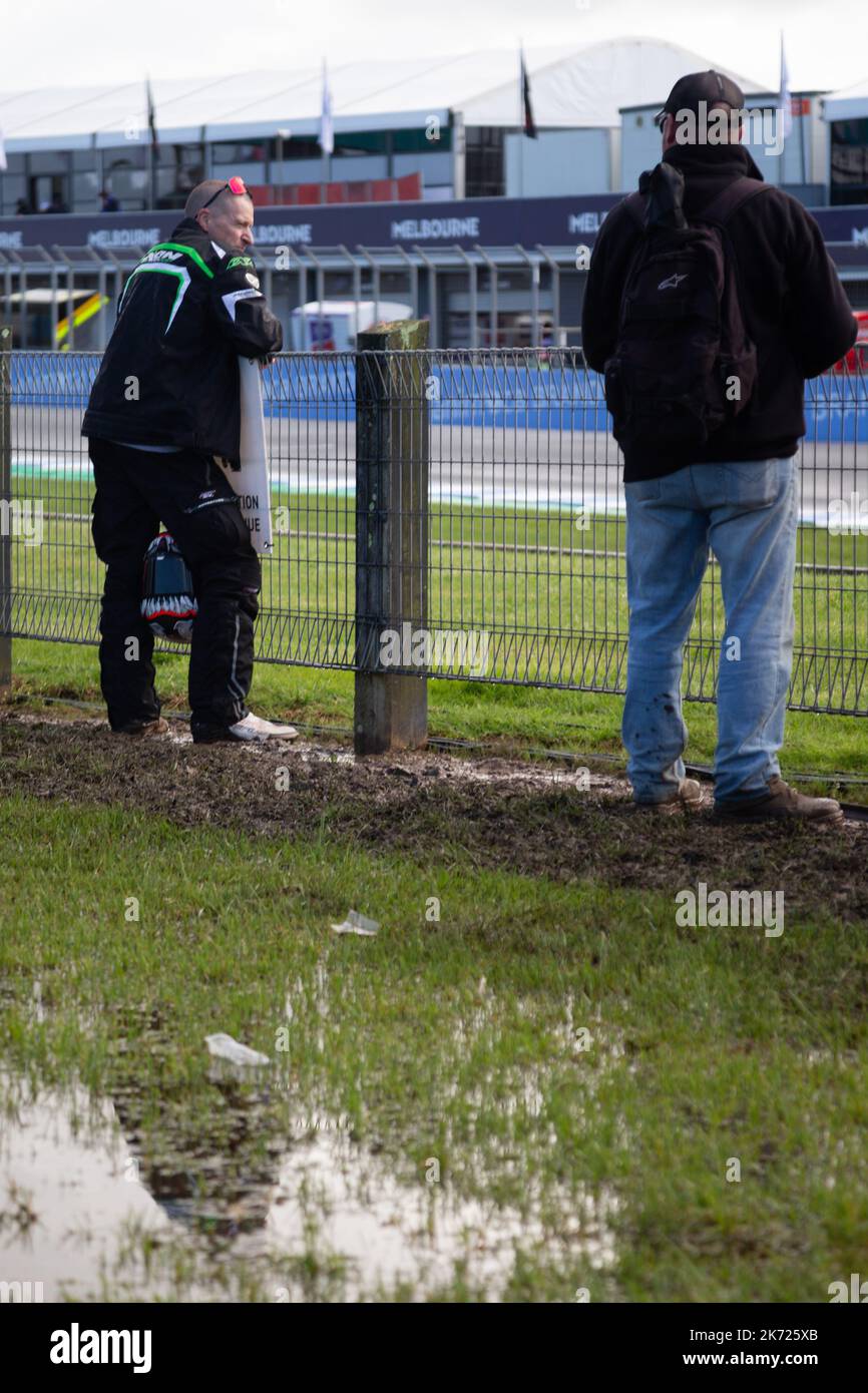 Phillip Island, Australia, 16 October, 2022. Fans stand deep in mud ...