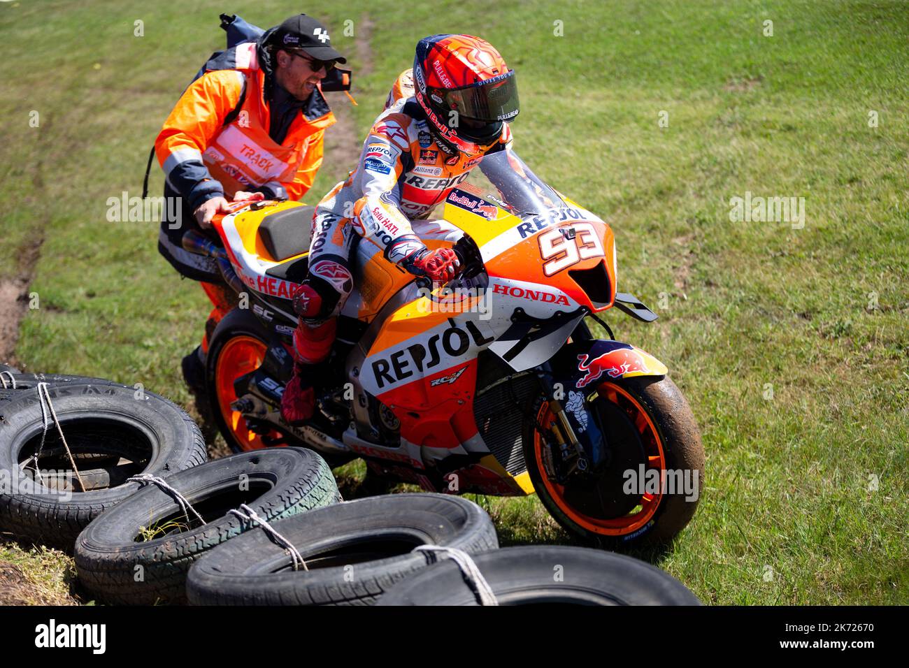 Phillip Island, Australia, 16 October, 2022. A marshal helps push Marc ...